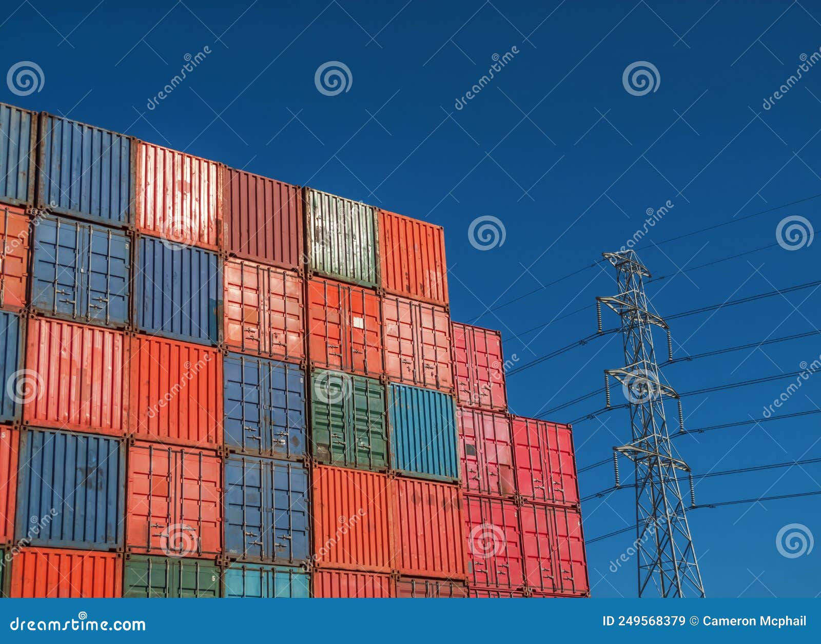 Stack of Shipping Containers with Electricity Pylon Stock Image - Image ...