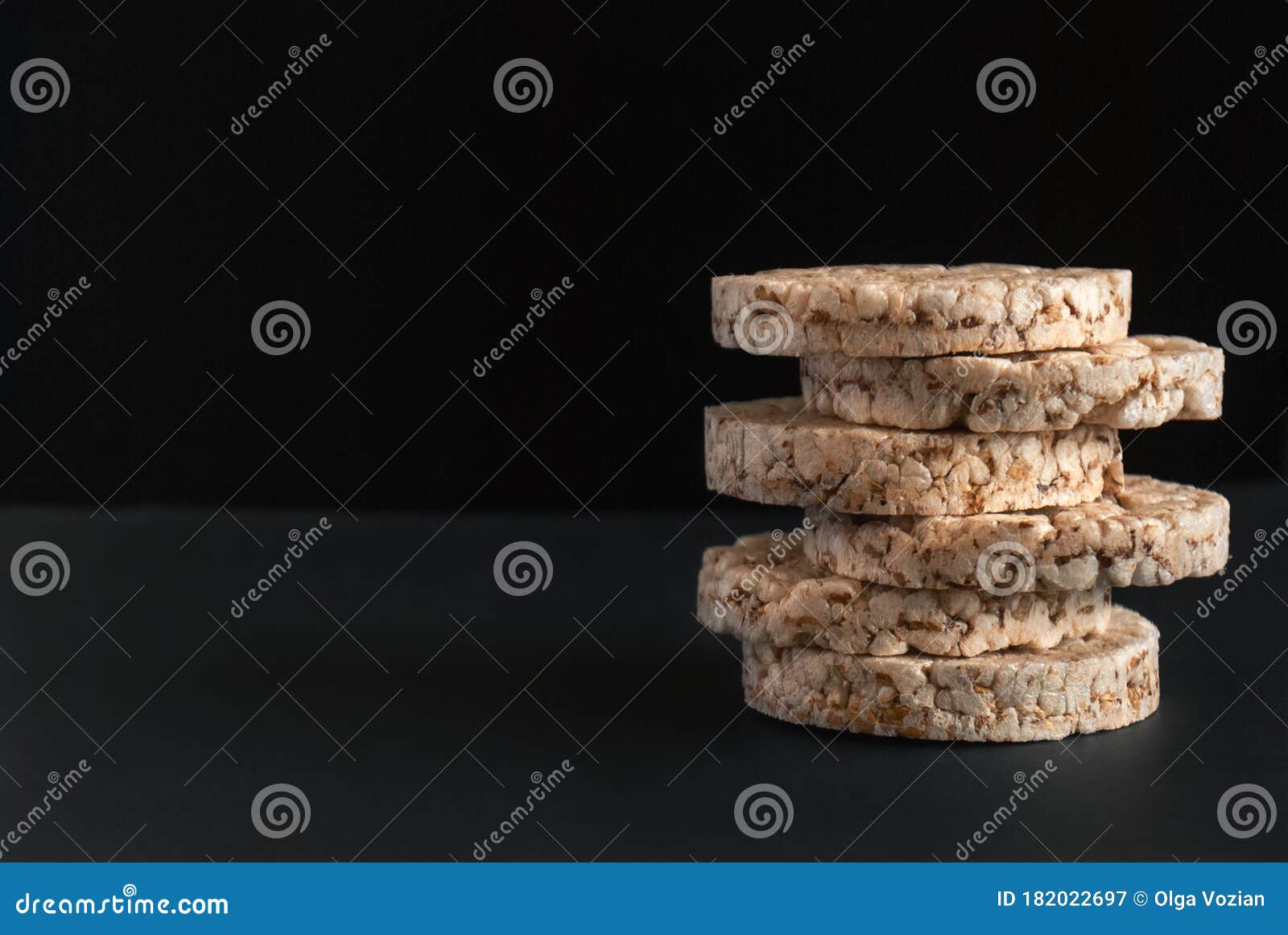 Round Crisp On A Black Stone Background. Rice Grains, Oatmeal Flakes ...