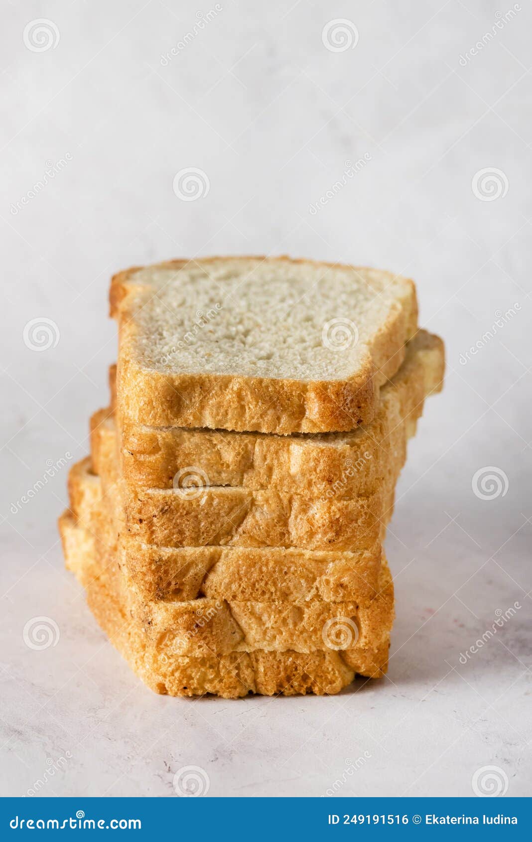Stack of Sliced White Bread on Gray Background Vertical Stock Photo ...