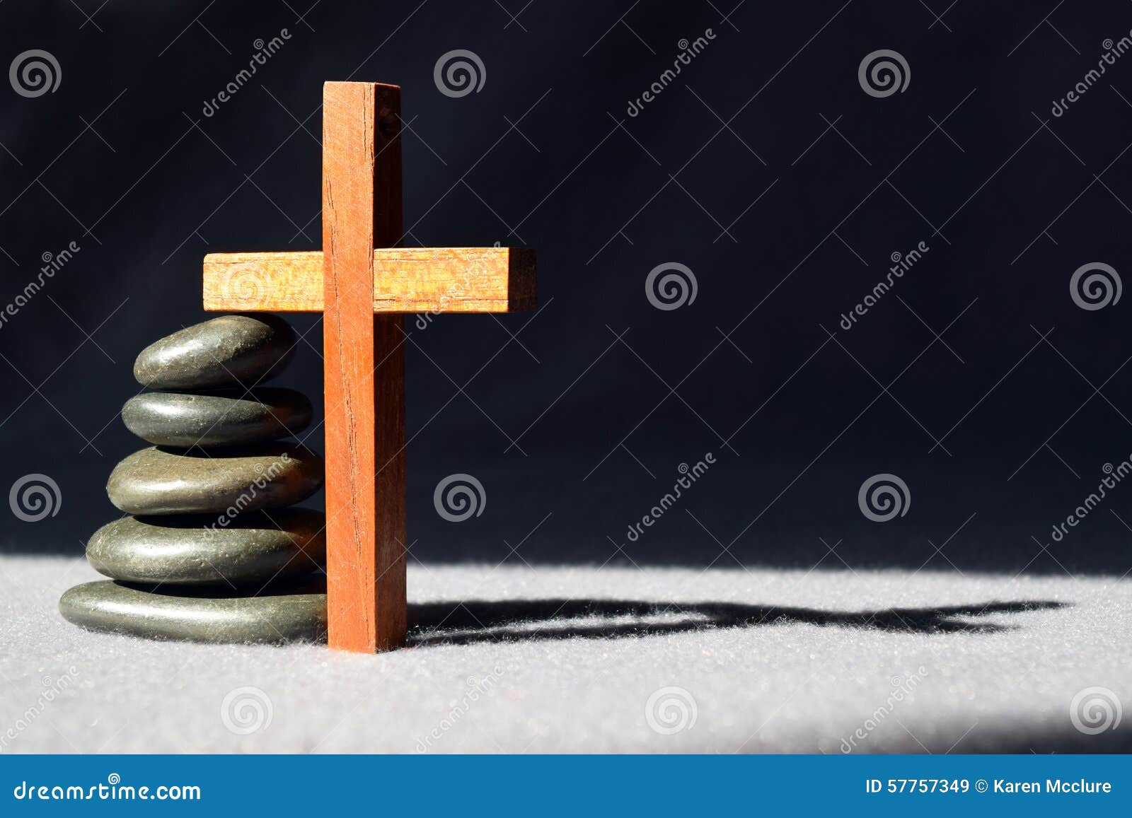 Stack of Smooth Stones with a Simple Wooden Cross Stock Image - Image ...