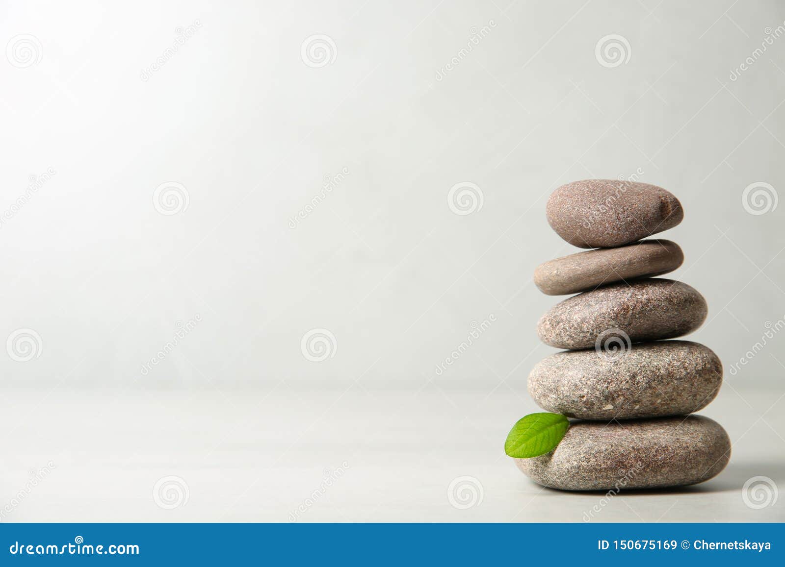 Stack of Spa Stones with Leaf on Light Background Stock Image - Image ...