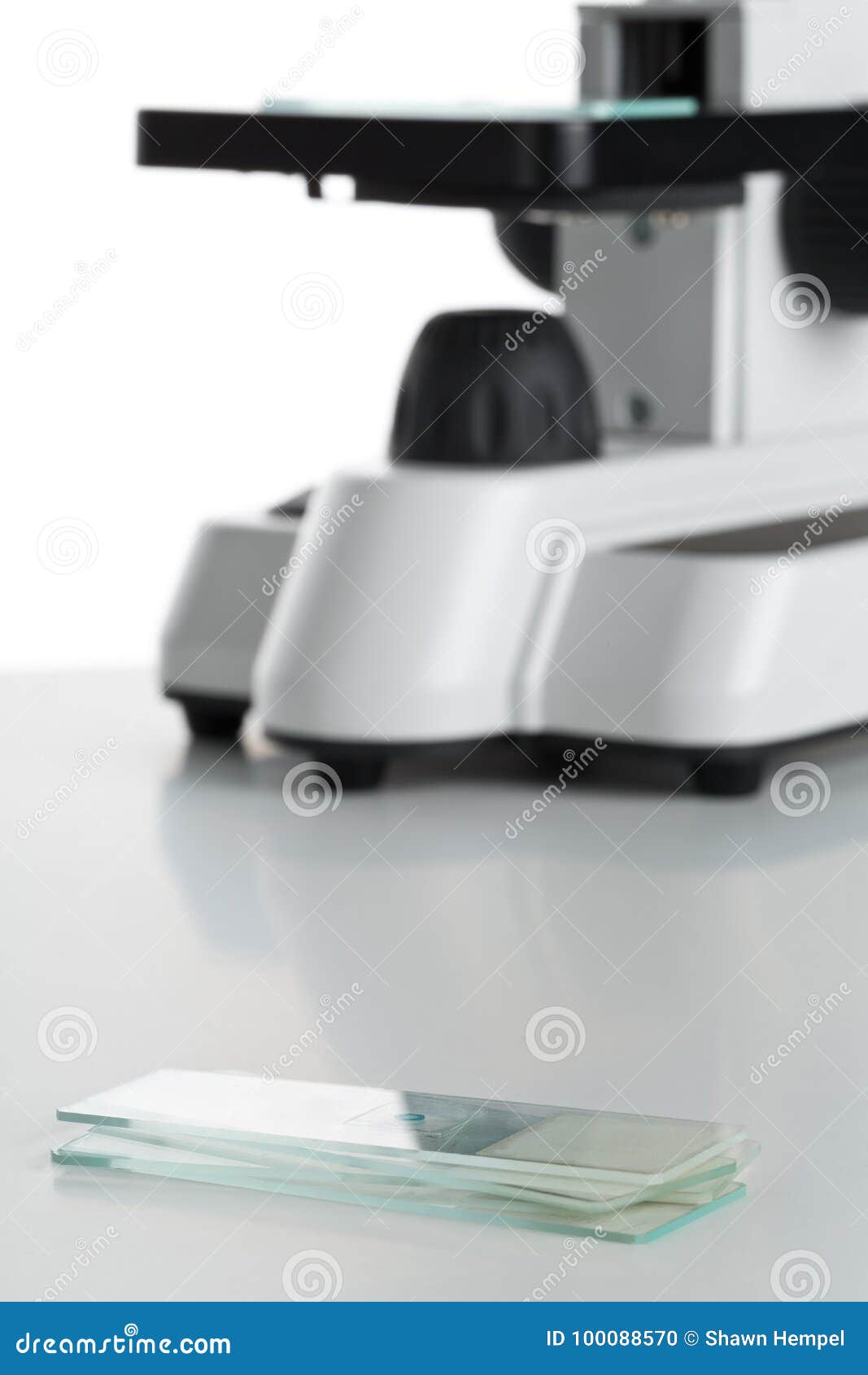 Stack of Specimen Holders in Front of Microscope Stock Photo - Image of ...