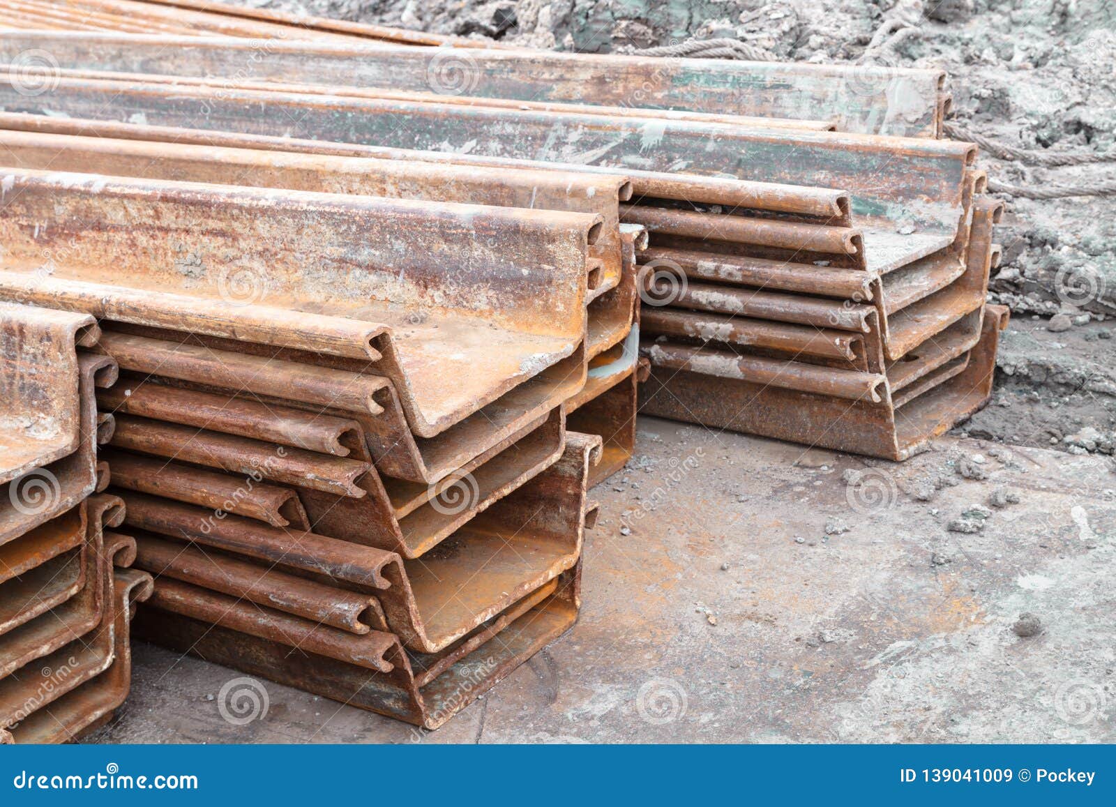 Stack of steel sheet pile stock image. Image of group - 139041009