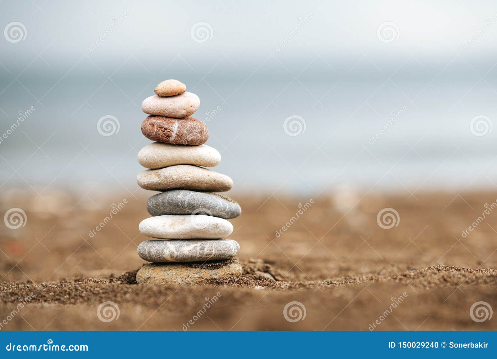 Stack of Stone Over the Sand. Balance and Stability Concept with Stones ...