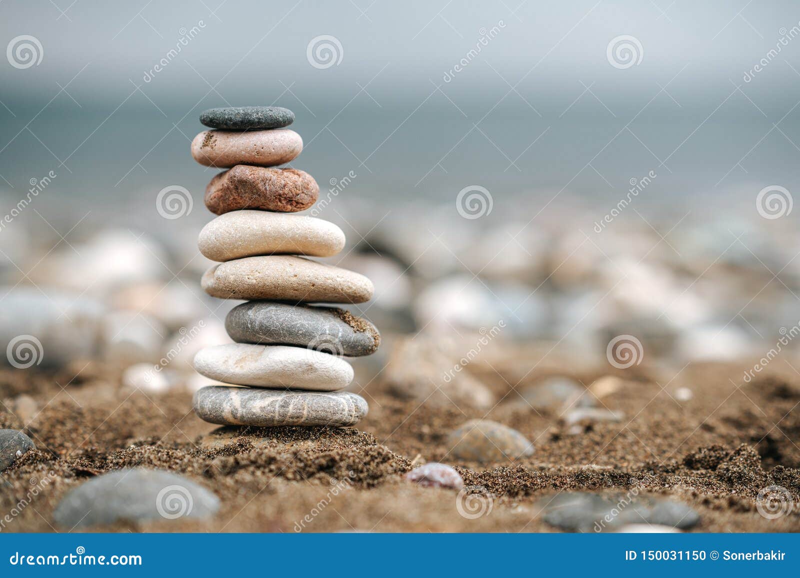 Stack of Stone Over the Sand. Balance and Stability Concept with Stones ...