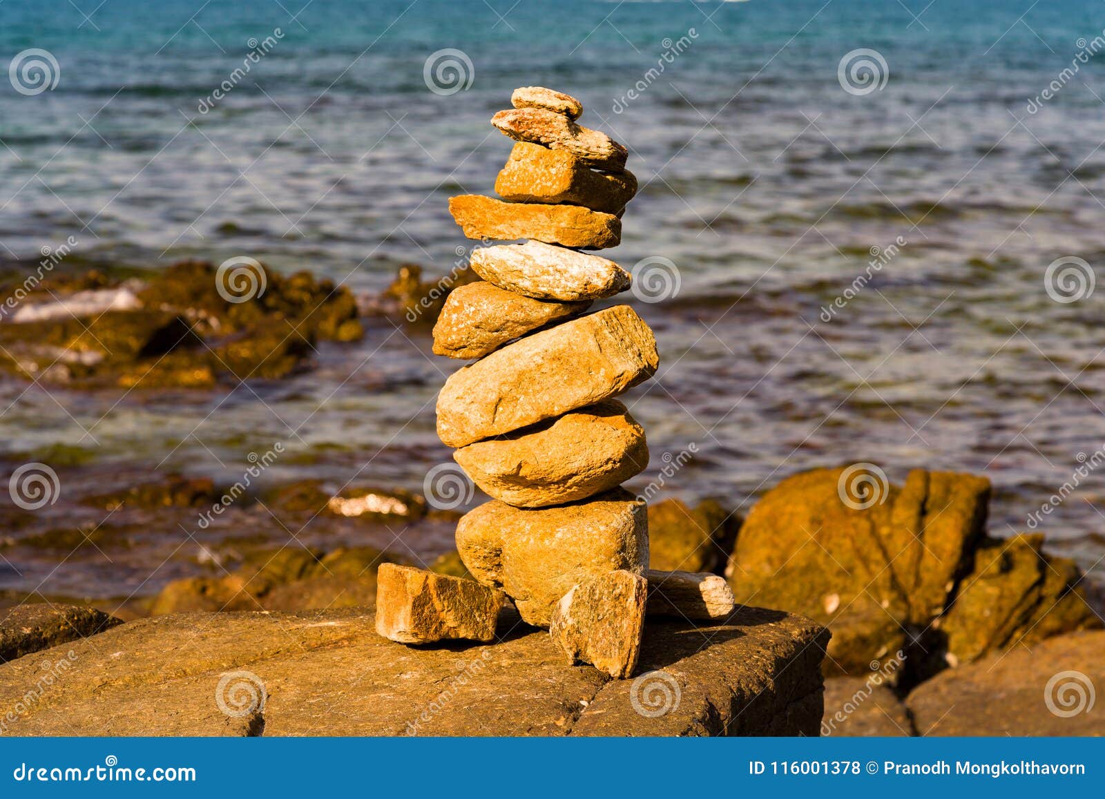 Stack stone over sea shore stock photo. Image of meditation - 116001378