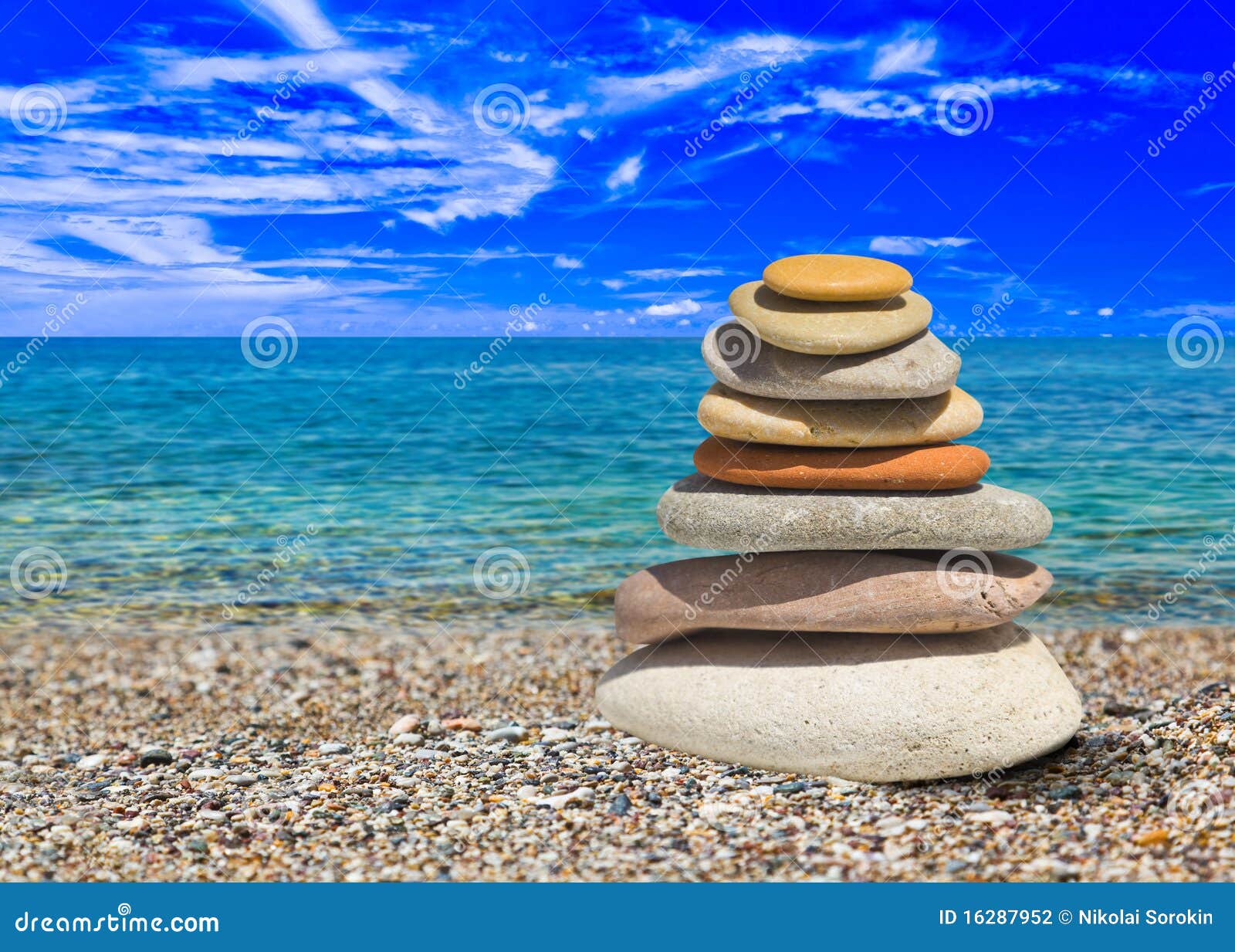 Stack of stones on beach stock photo. Image of culture - 16287952