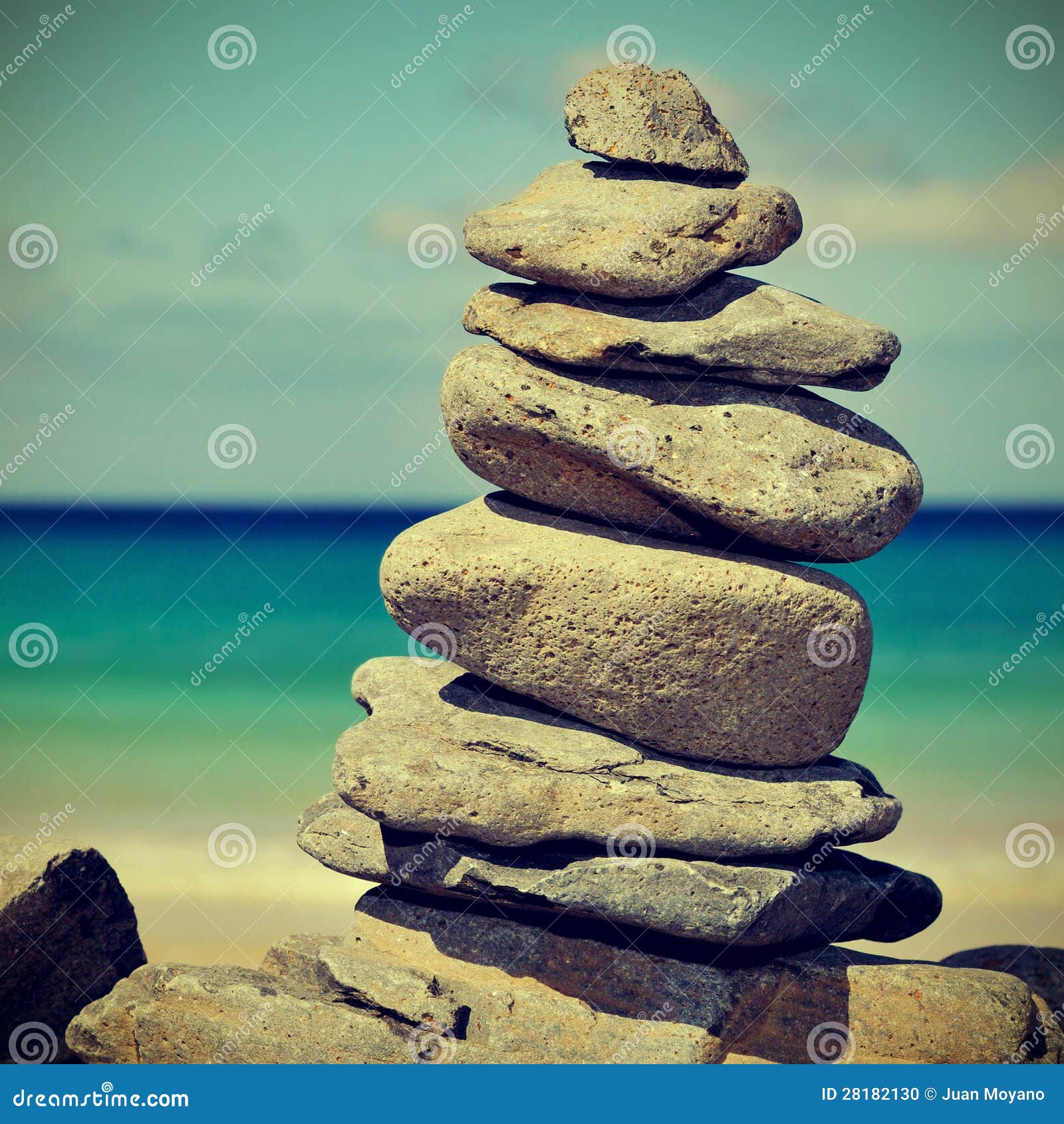 Stack of stones on a beach stock photo. Image of sensitive - 28182130