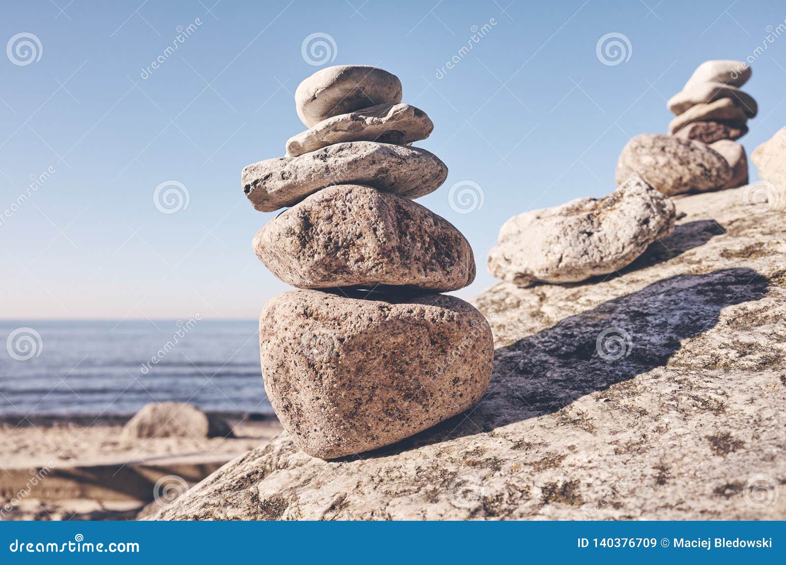 Stack of stones on a beach stock image. Image of symbol - 140376709