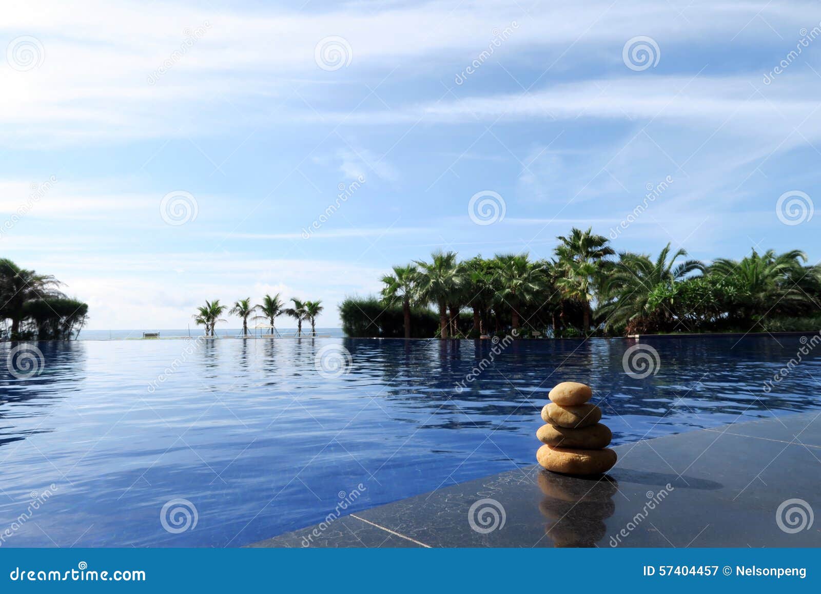 Stack of Stones on Pool Edge Stock Image - Image of stack, blue: 57404457