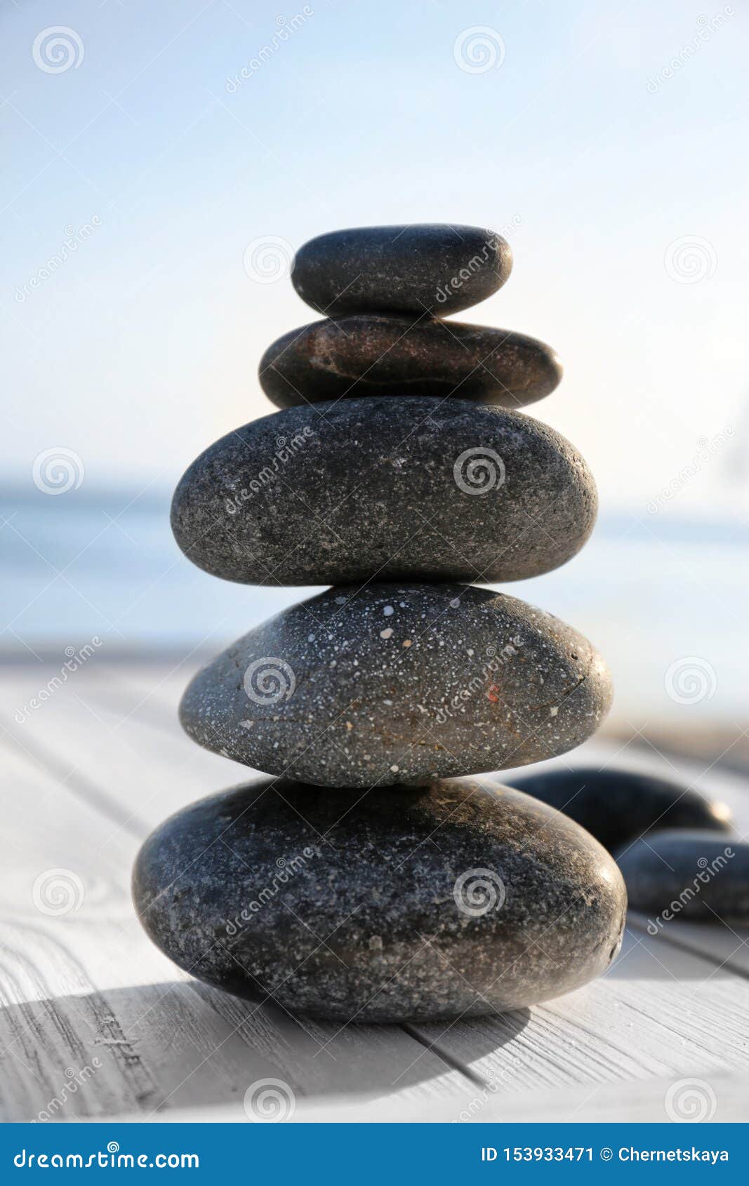 Stack of Stones on Wooden Deck Outdoors Stock Image - Image of abstract ...