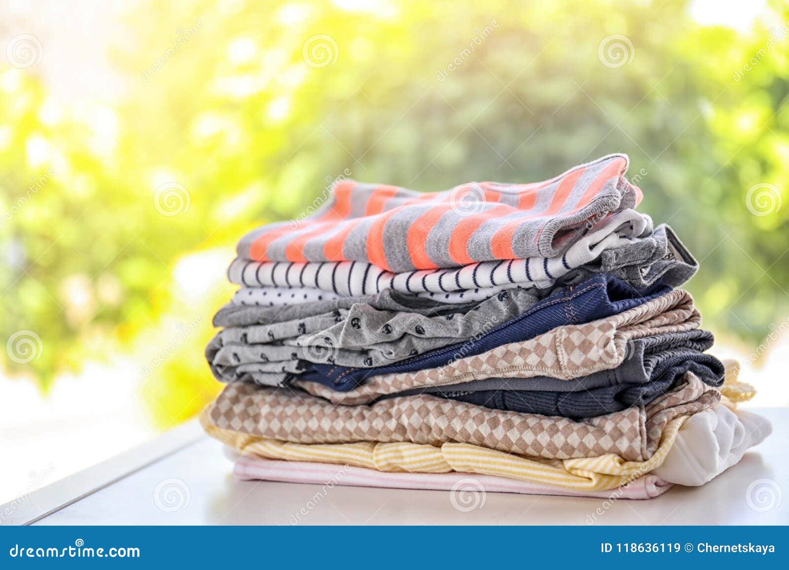Stack of Stylish Child Clothes on Table Stock Image - Image of babyhood ...