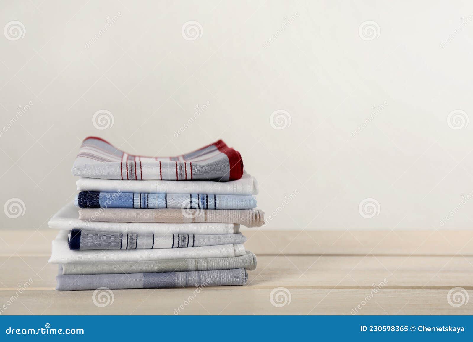 Stack of Stylish Handkerchiefs on White Wooden Table, Space for Text ...
