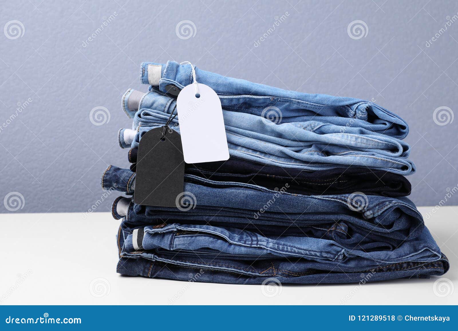 Stack of Stylish Jeans with Tags Stock Photo - Image of apparel ...