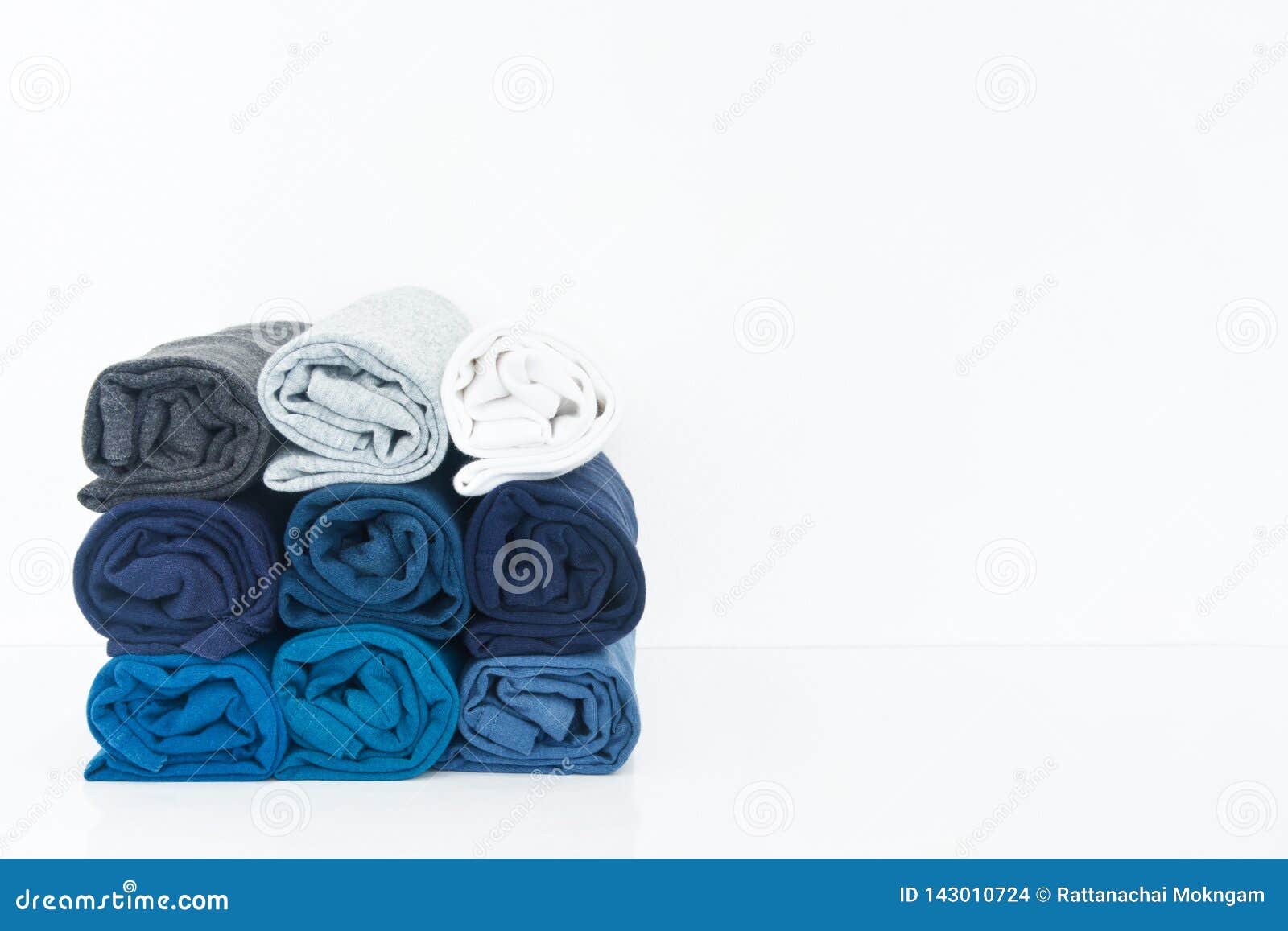 Stack of T-shirt Rolled Up on White Background Stock Photo - Image of ...