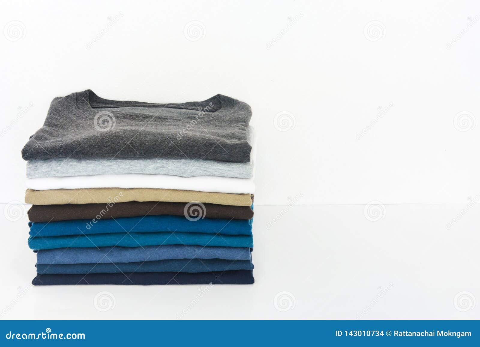 Stack of Folded T-shirt on White Background Stock Photo - Image of ...