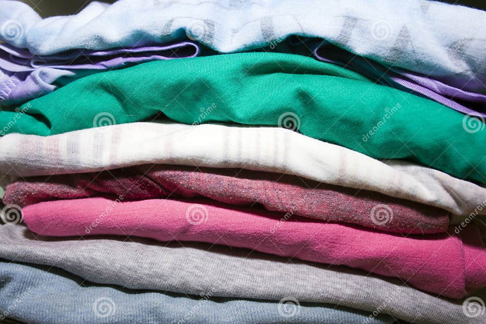 A stack of t-shirts stock photo. Image of wallpaper, shirts - 72942246