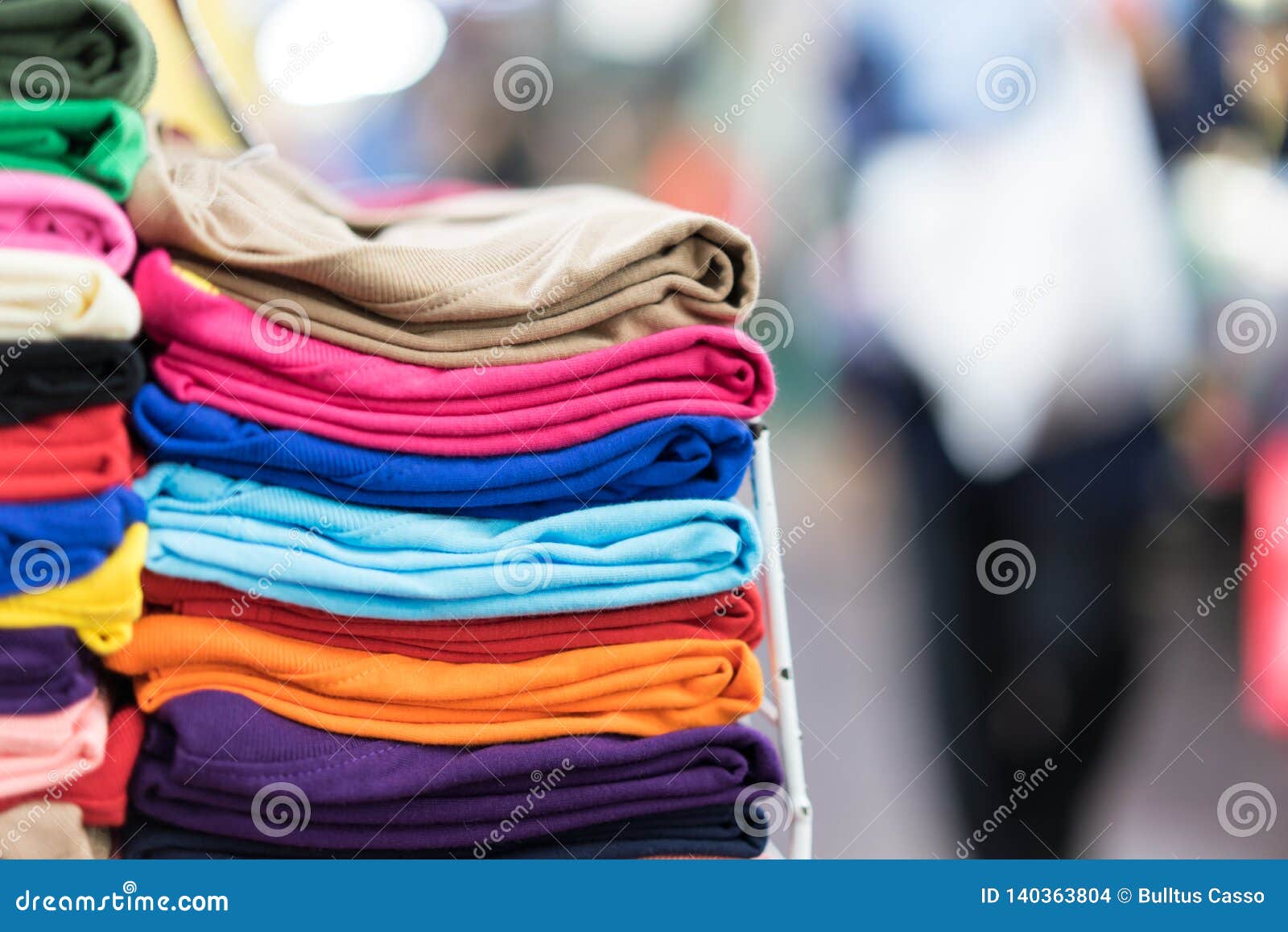 Stack T-shirts on Shelf in a Shop Stock Photo - Image of object, folded ...