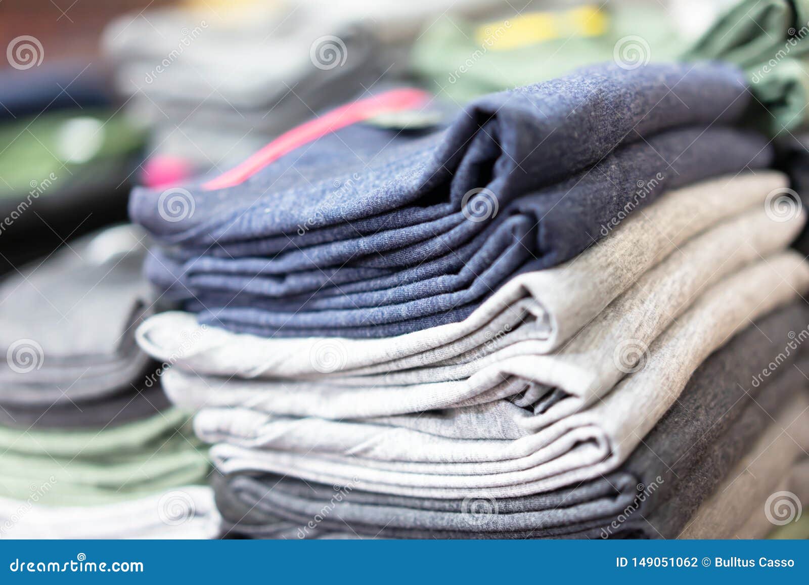 Stack T-shirts on Shelf in a Shop Stock Photo - Image of clothes ...
