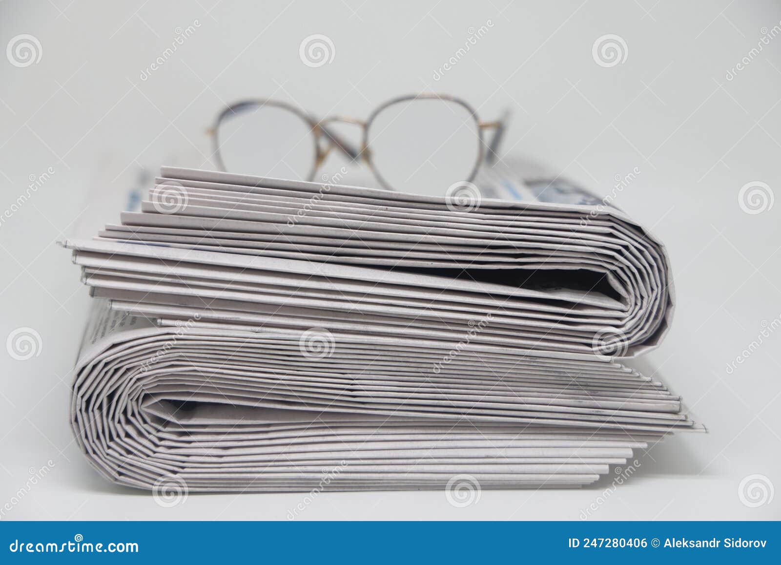 A Stack of Tabloid Format Folded Newspapers Isolated on White ...