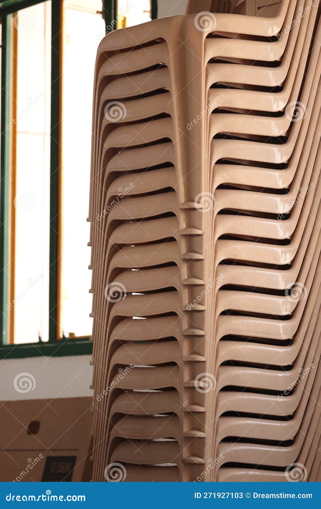 A Stack of Tan Plastic Chairs, about 20 High. Stock Image - Image of ...