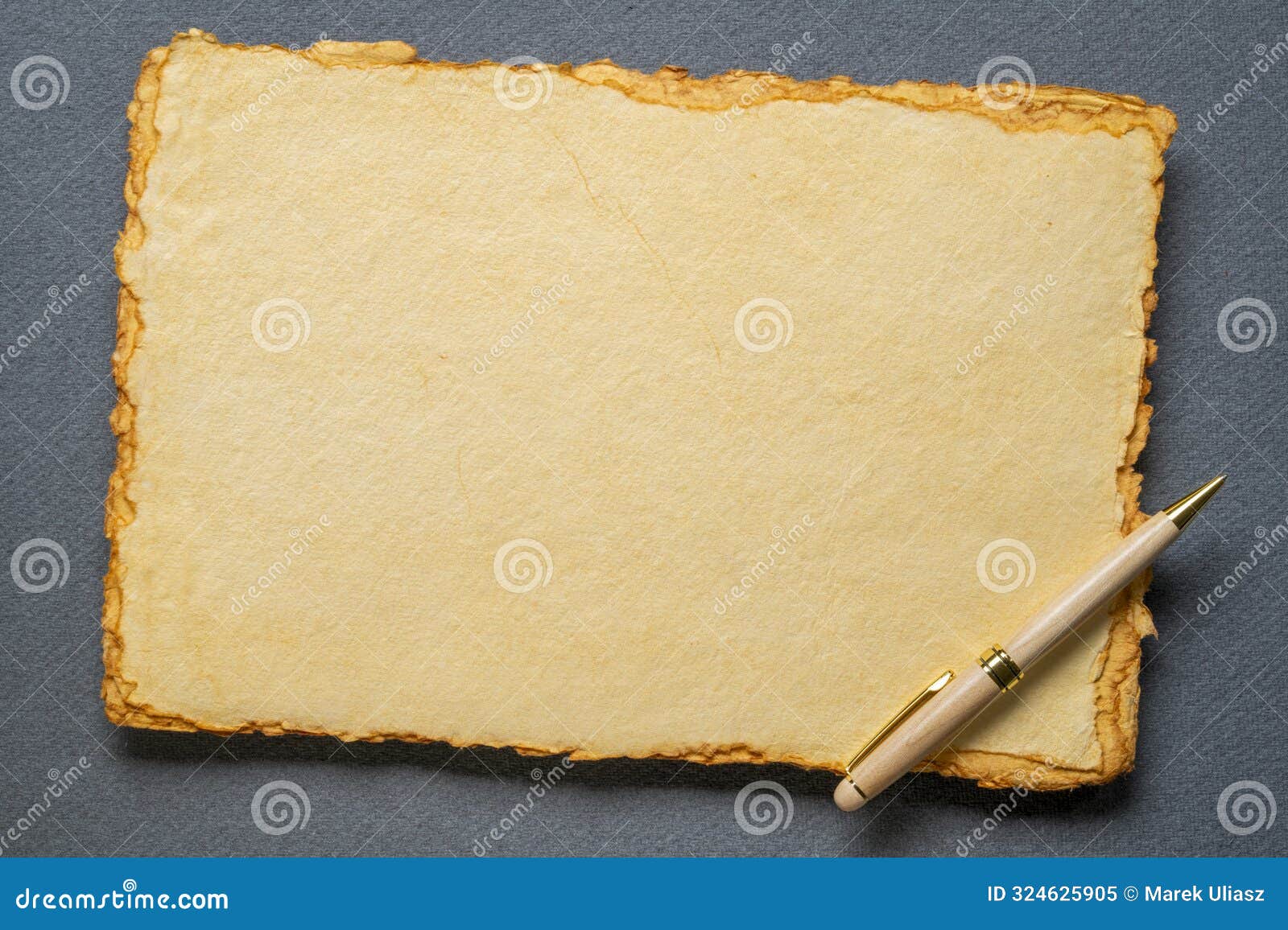 Stack of Tan Toned Heavyweight Deckle Edge Paper Sheets with a Pen ...