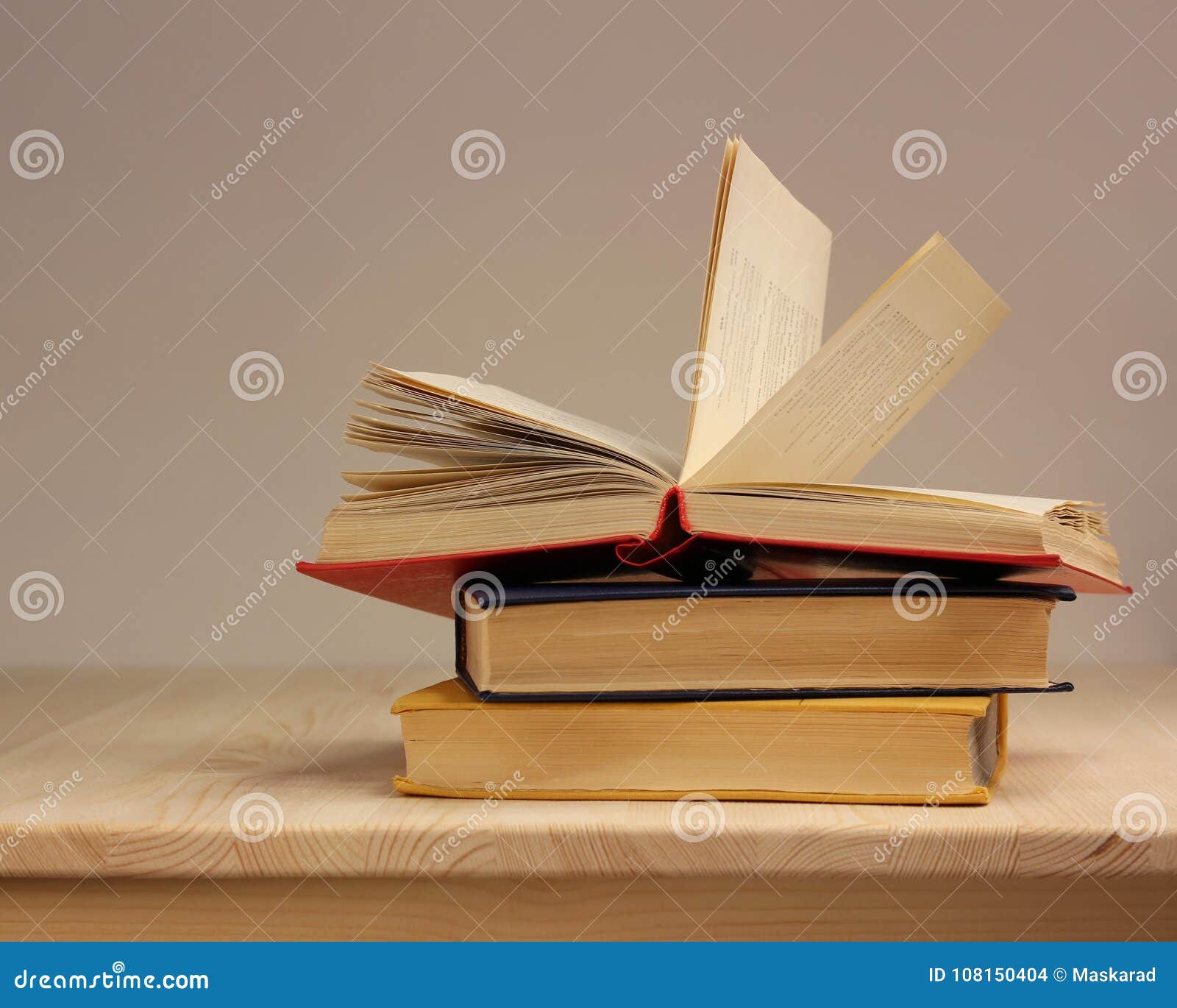 Stack of Three Books in the Colored Cover on the Table. Stock Photo ...