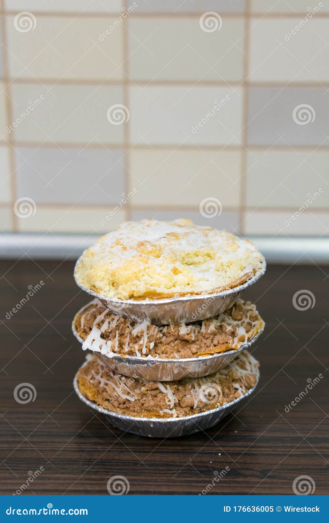 Stack of Three Different Pies on a Wooden Surface Stock Image - Image ...