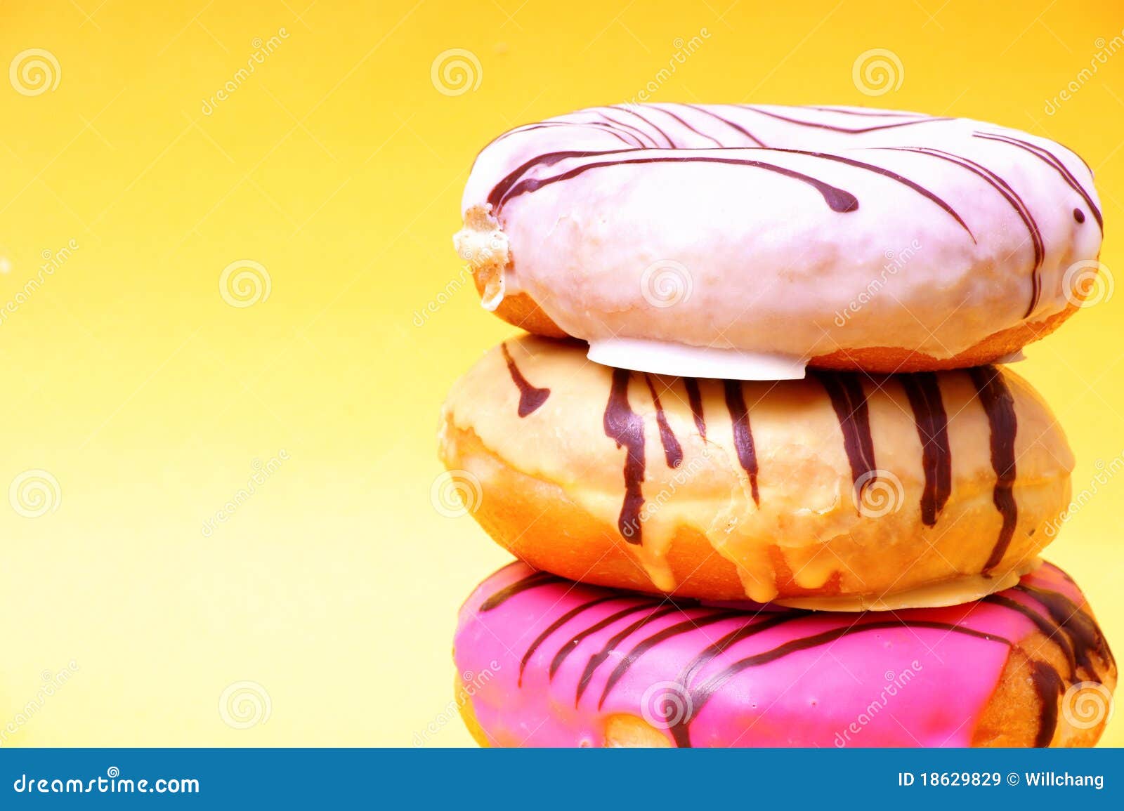 Stack of three donuts stock image. Image of junkfood - 18629829