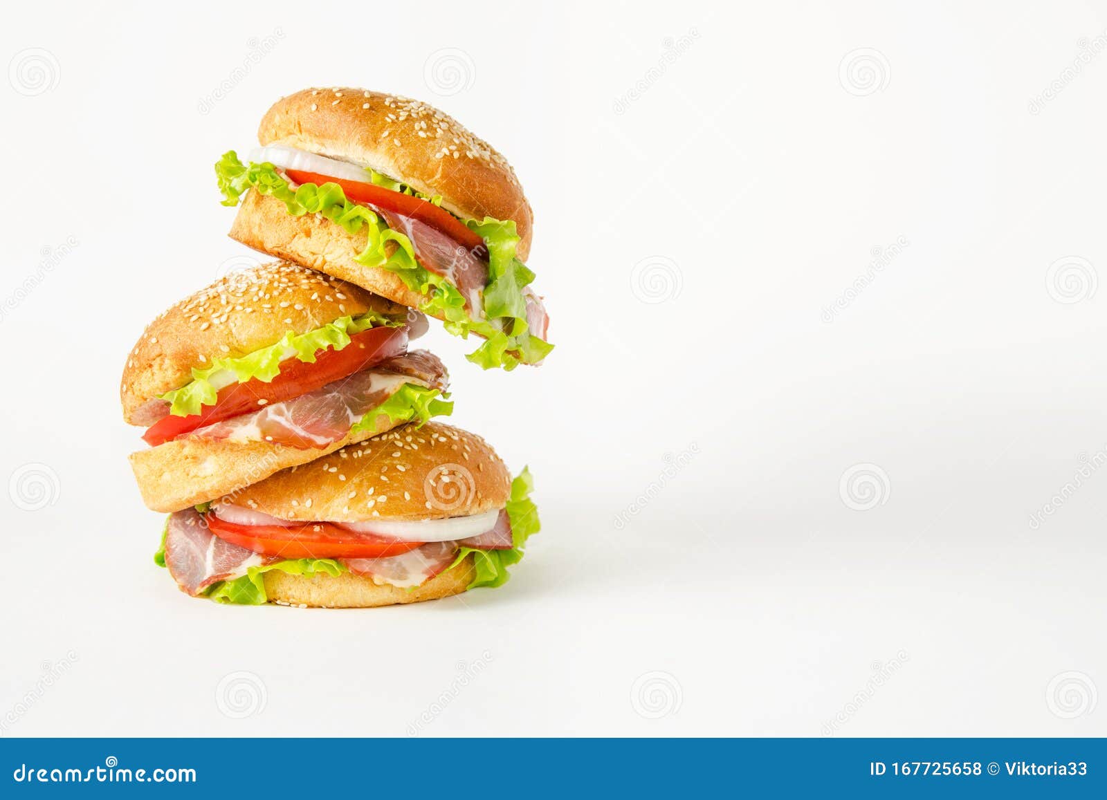 Stack of Three Falling Hamburgers Standing on a Light Background Stock ...