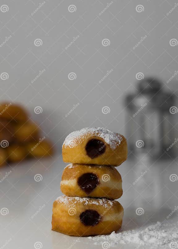 Stack of Three Jelly-filled Doughnuts Dusted with Powdered Sugar on a ...