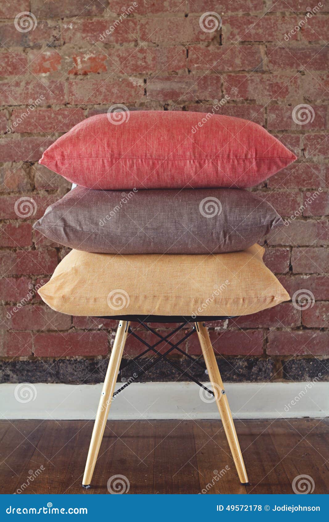 Stack of Three Linen Cushions on Chair Stock Photo - Image of close ...