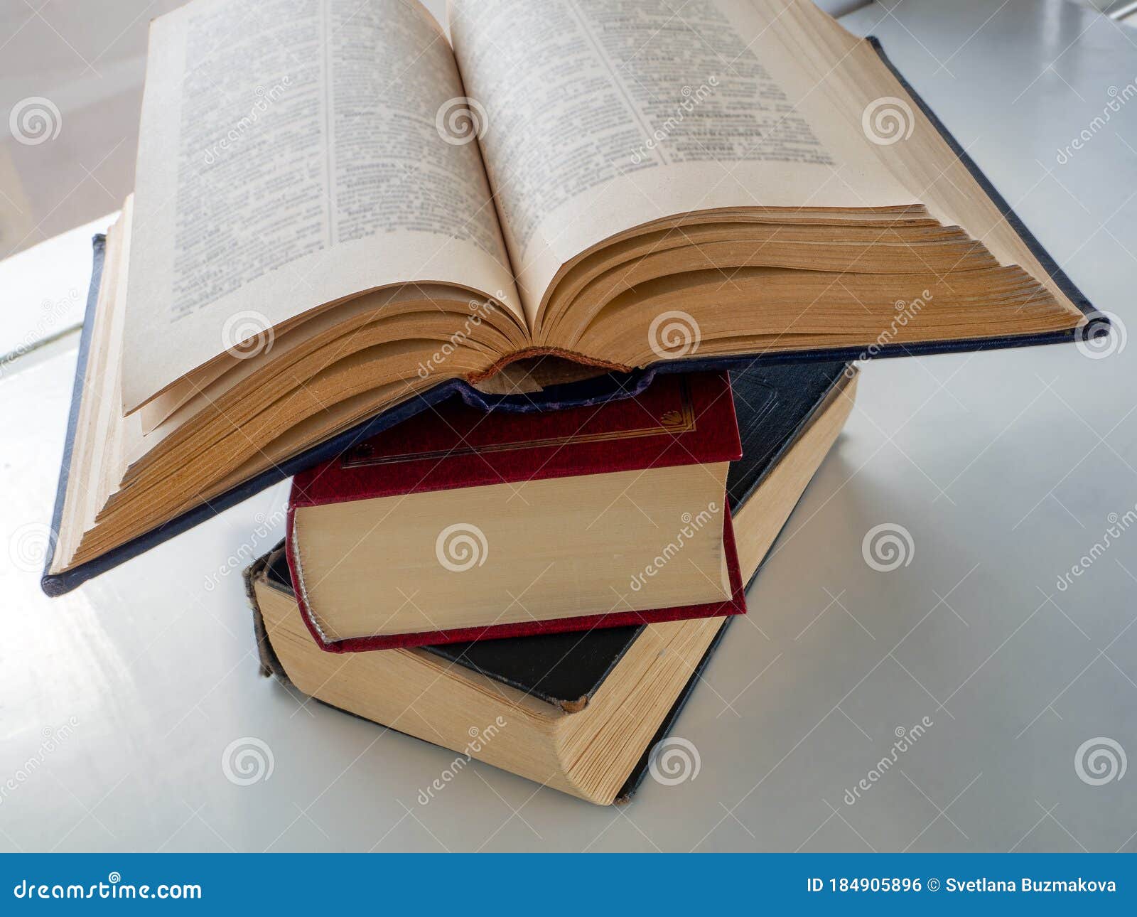 A Stack of Three Old Books that Lie on Top of Each Other. Background ...