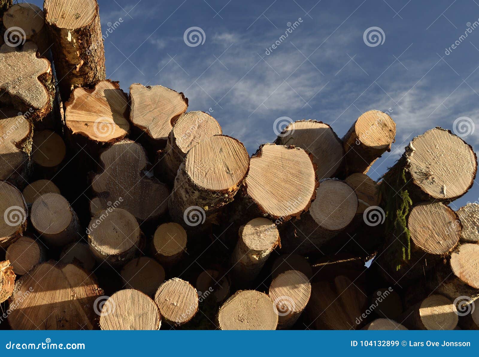 Stack of Timber Against a Blue Sky Stock Image - Image of stacked ...