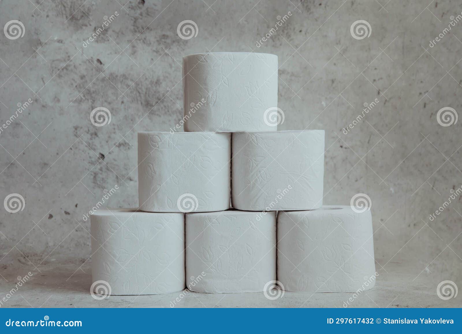 Stack of Toilet Paper Rolls on a Gray Light Background Stock Photo ...