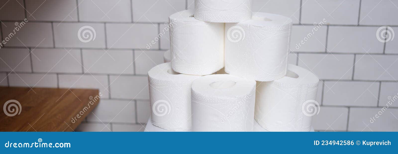 Stack of Toilet Paper Stands on White Toilet in Bathroom Closeup Stock ...