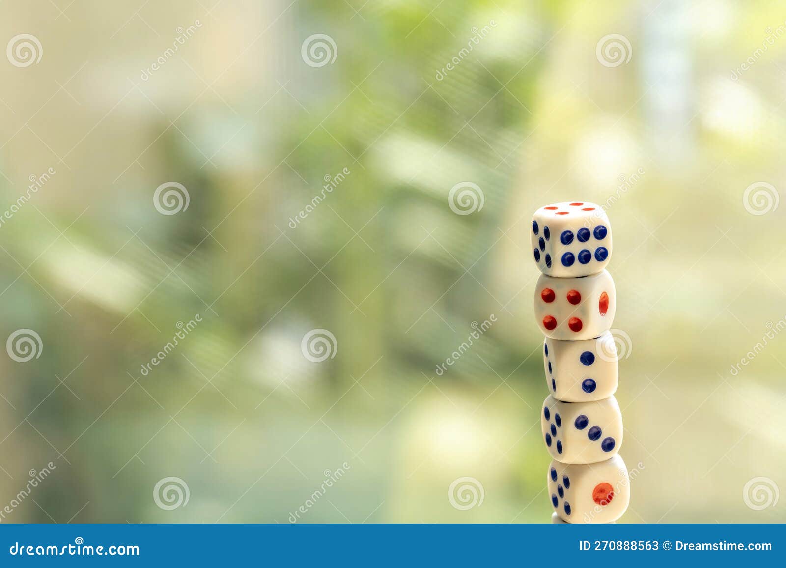 Stack Tower of Many Small Game Dice Isolated on a Bright Blurred ...