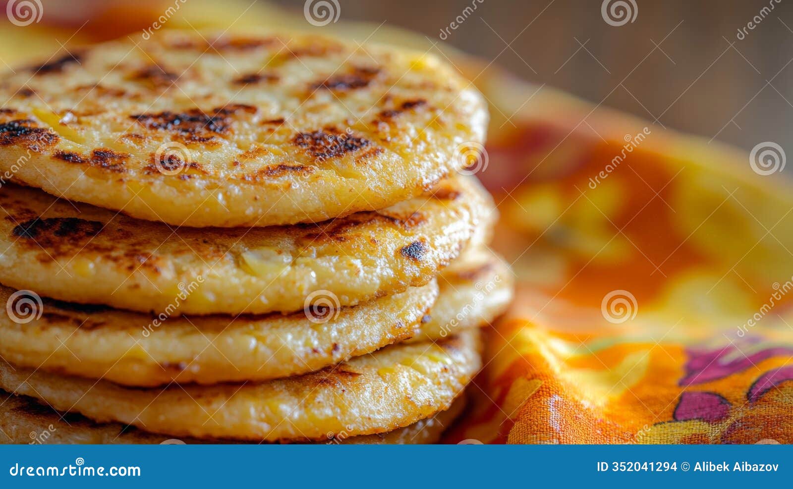 Stack Of Traditional Arepas With Warm Orange-cloth Background Stock ...