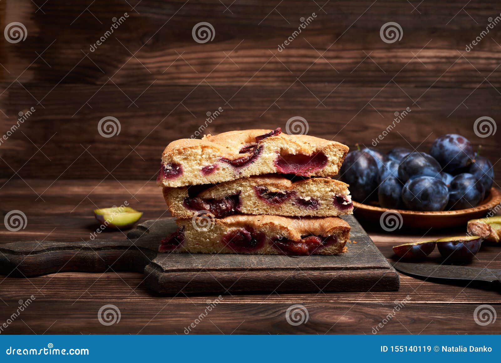Stack of Triangular Slices of Sponge Cake with Blue Plums Stock Image ...