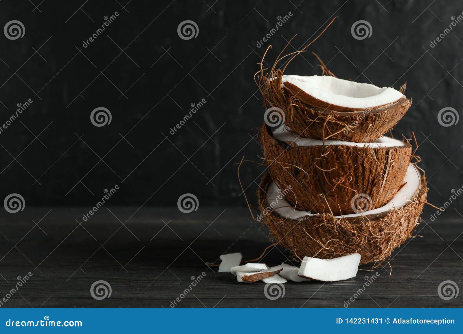 Stack Tropical Coconut on Wooden Table Against Black Background Stock ...