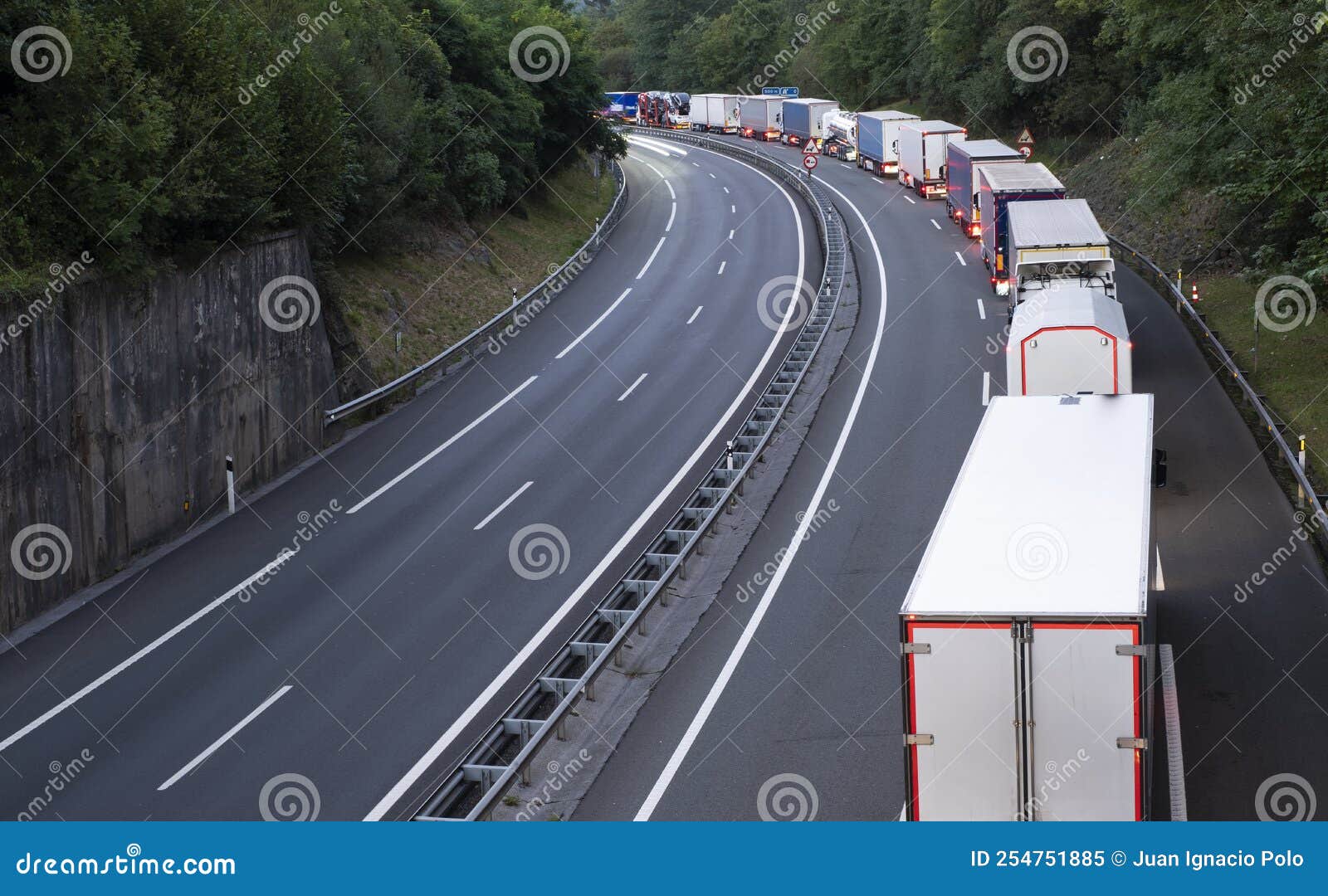 Stack of Trucks in a Long Traffic Jam on the Freeway at Night Stock ...