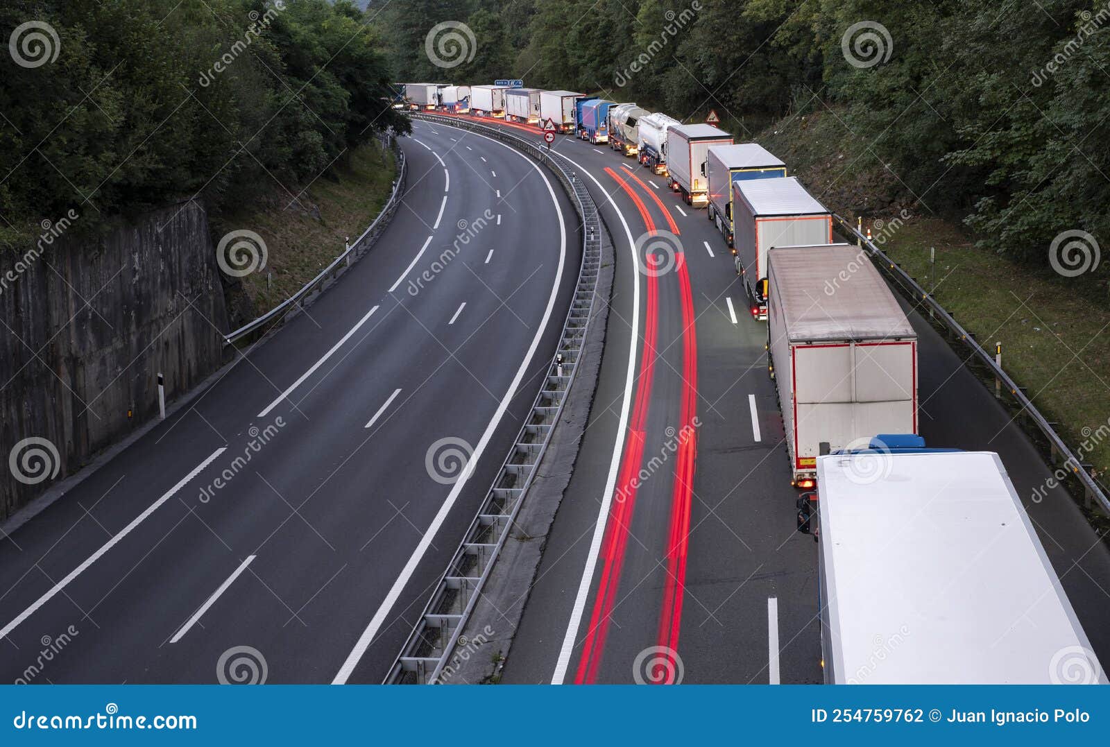 Stack of Trucks in a Long Traffic Jam on the Freeway at Night Stock ...