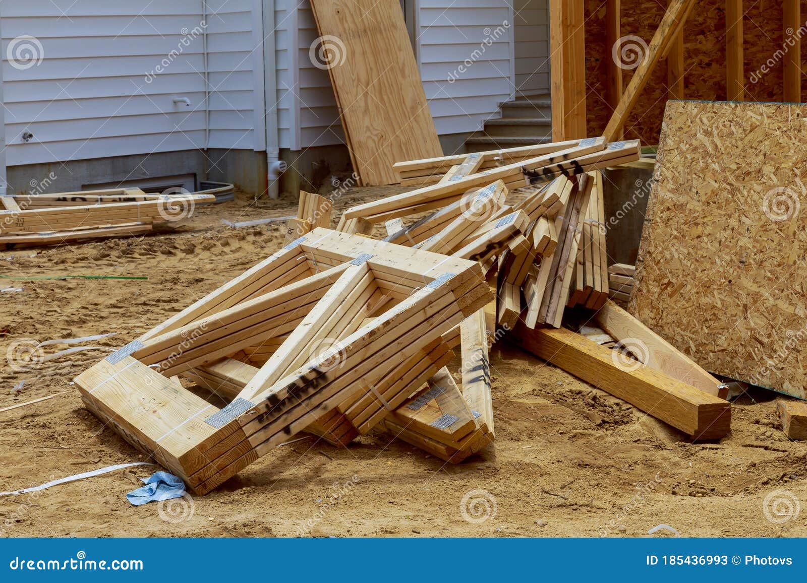 Stack Of Unloading Wooden Beams On Construction Building From Beam ...