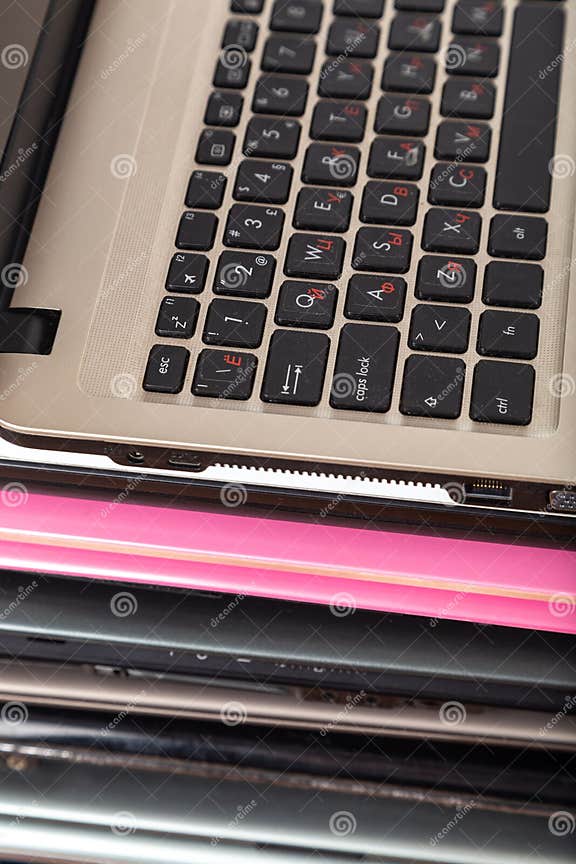 Stack of Used Laptops in Different Colors and Models. T Stock Photo ...