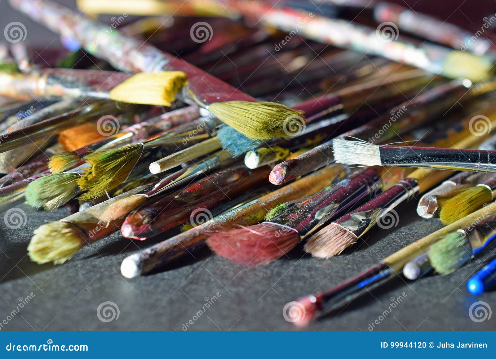 Stack of used paintbrushes stock photo. Image of dark - 99944120