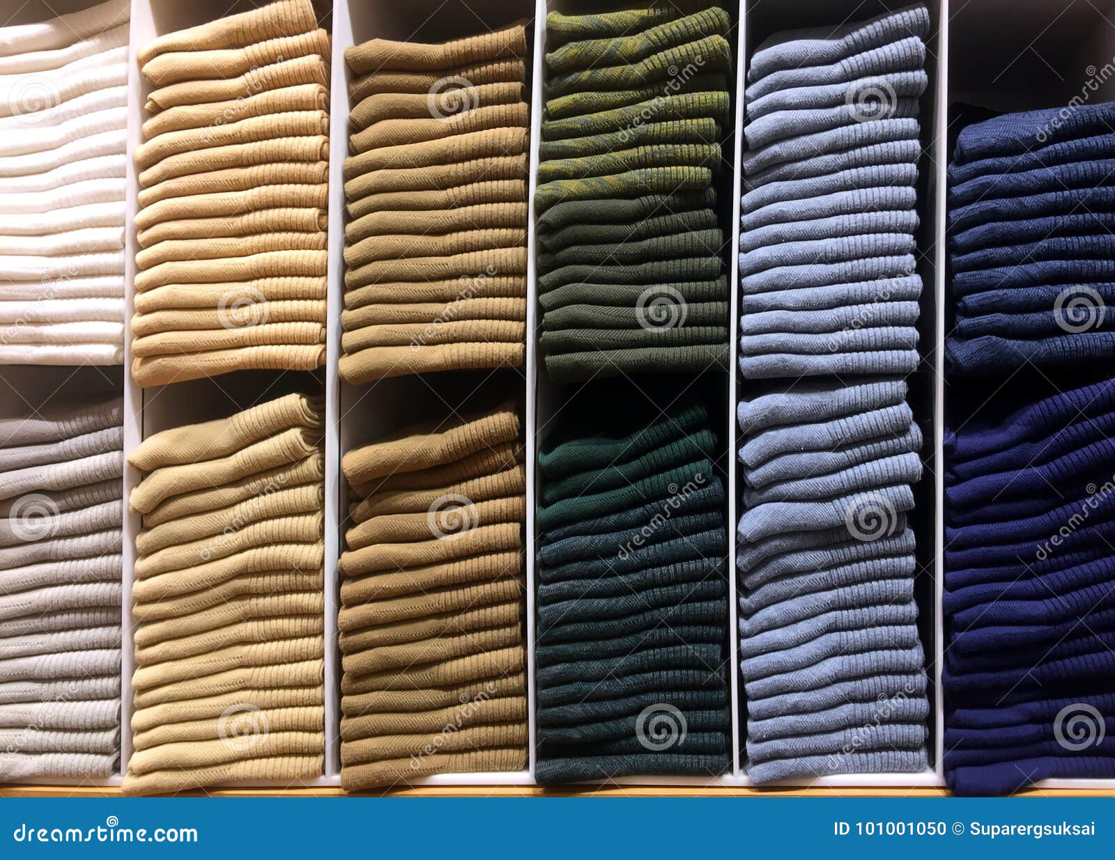 Stack of Various Color Clothes on Shelf Stock Photo - Image of stack ...