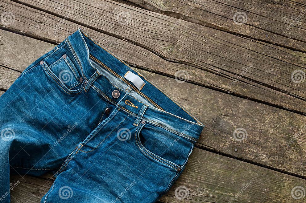 Stack of Various Denim Jeans, Trousers on Stone Rustic Background Stock ...