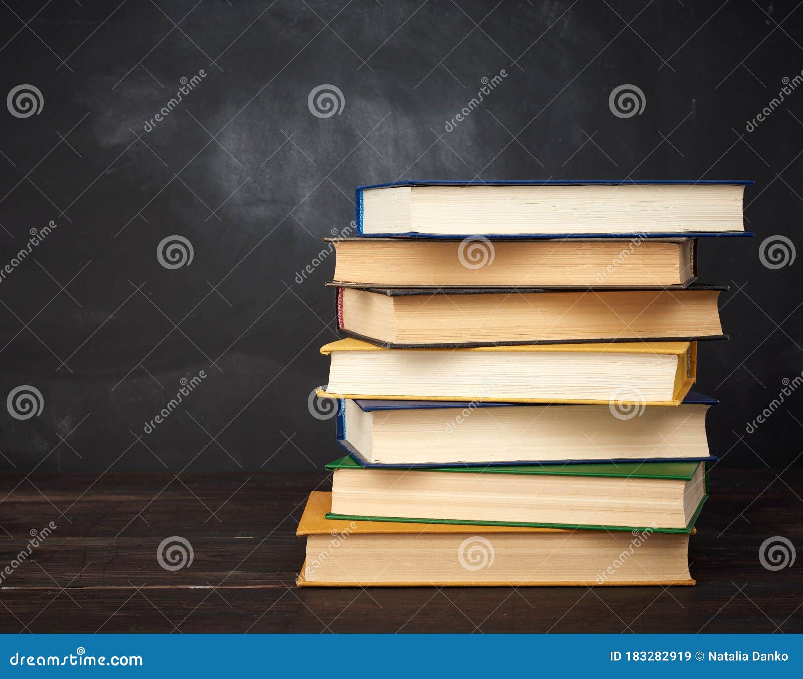 Stack of Various Hardback Books on the Background of an Empty Black ...