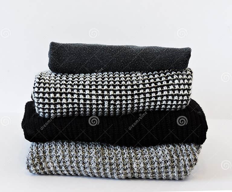 Stack of Various Sweaters Isolated on White Background. Knitted Wool ...