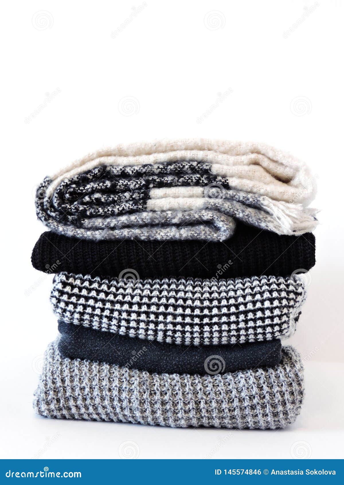 Stack of Various Sweaters Isolated on White Background. Knitted Wool ...
